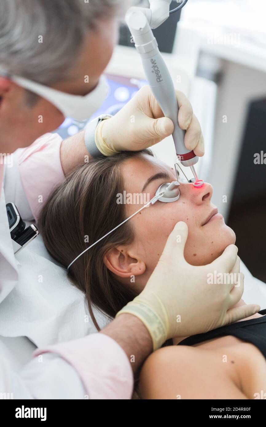 Vascular laser used in treatment of rosacea and varicosity Stock Photo ...