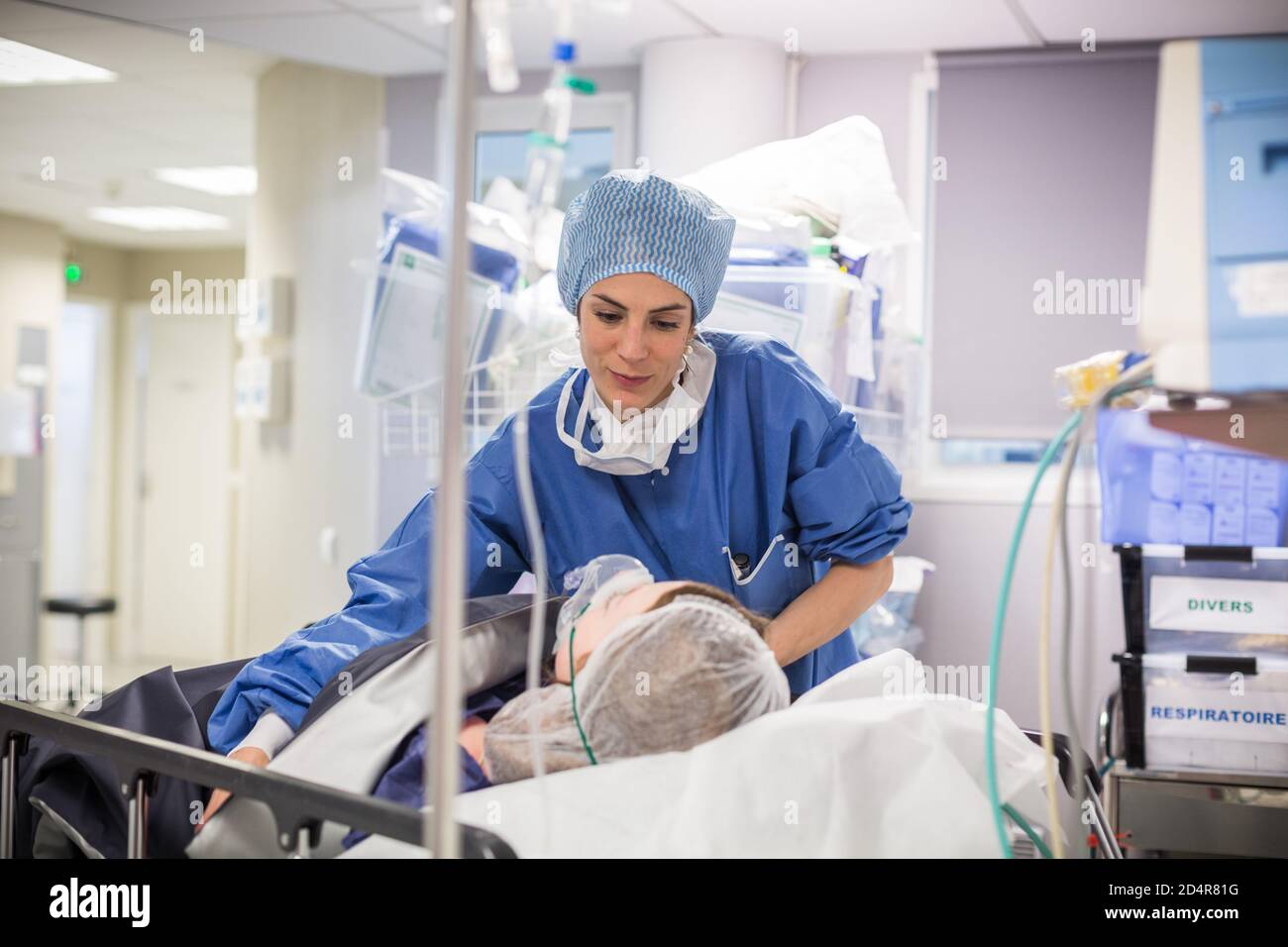Nurse with patient in post interventional surveillance room after ...