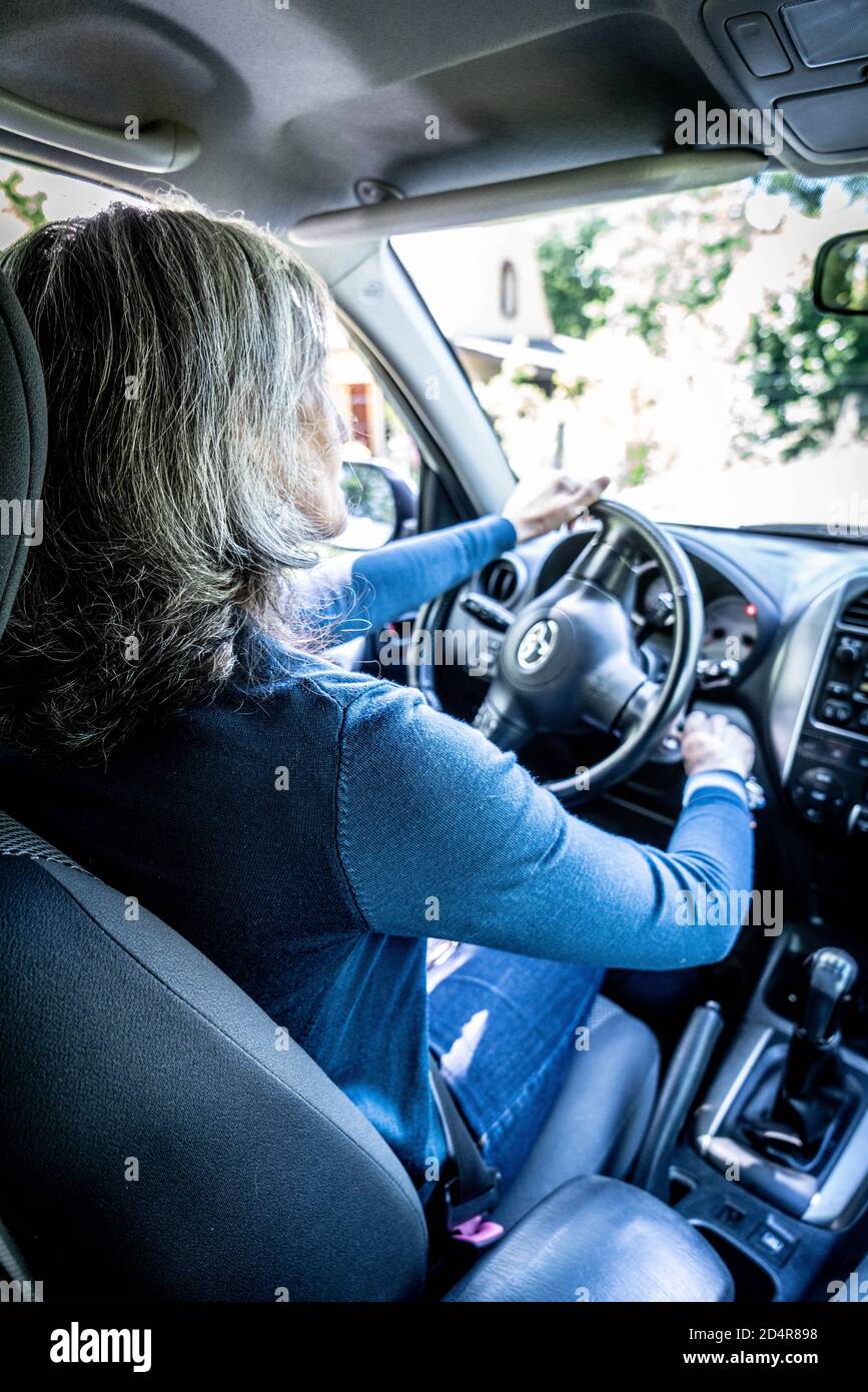 Woman driving her car Stock Photo - Alamy