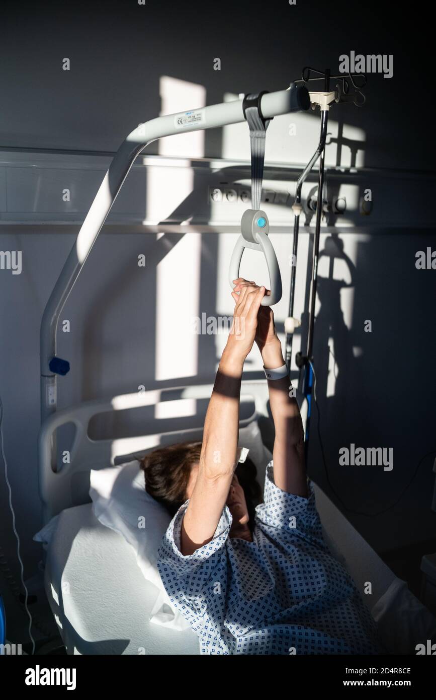 Hospitalized woman lying in hi-res stock photography and images - Alamy