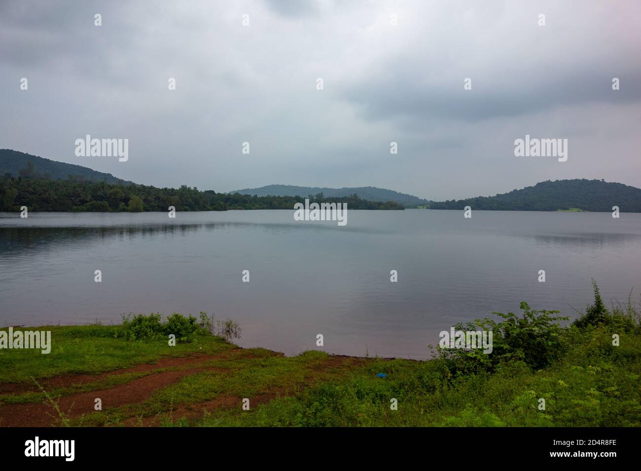 Pleasant view of Amthane Dam reservoir on an overcast day during ...