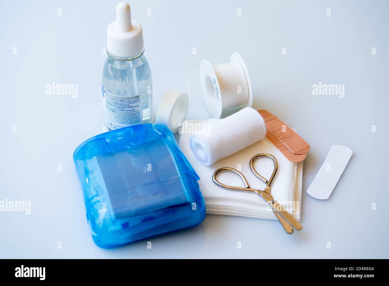First aid equipment. Scissors, tape and a safety pin, used to secure ...