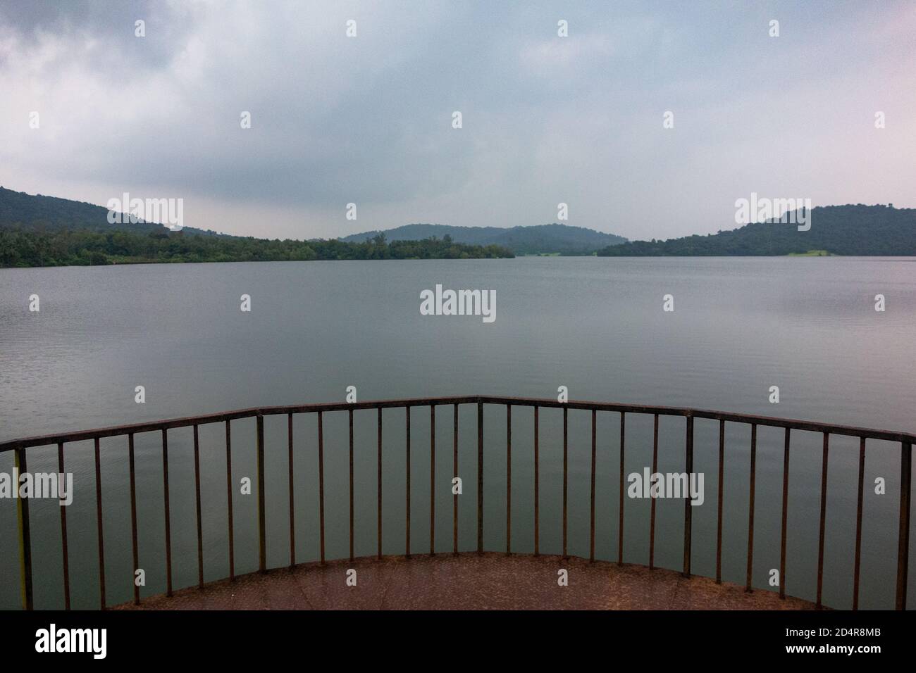 Pleasant view of Amthane Dam reservoir on an overcast day during ...