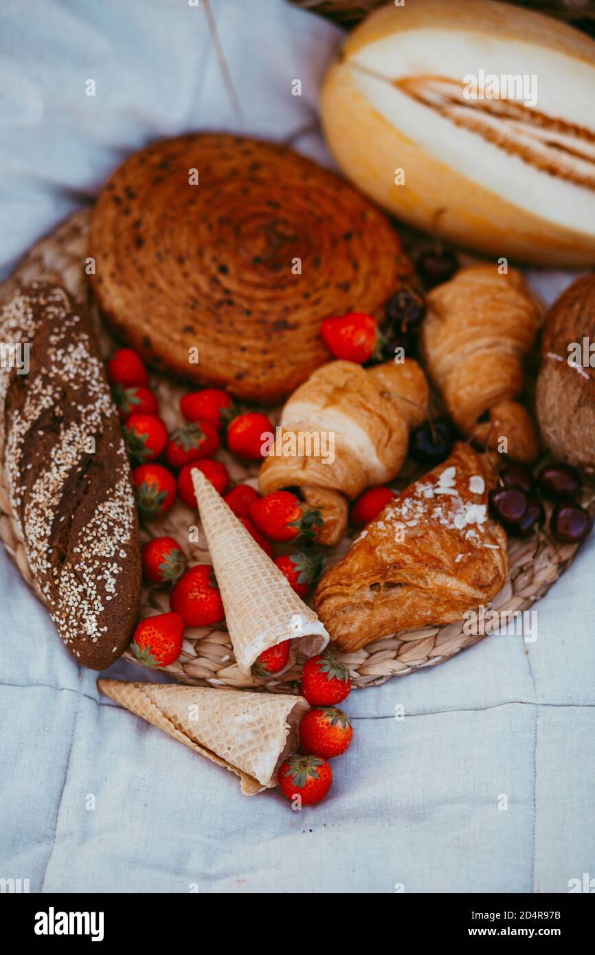 Top view of delicious food . fruit,bread ,croissants,melon on a pallet ...