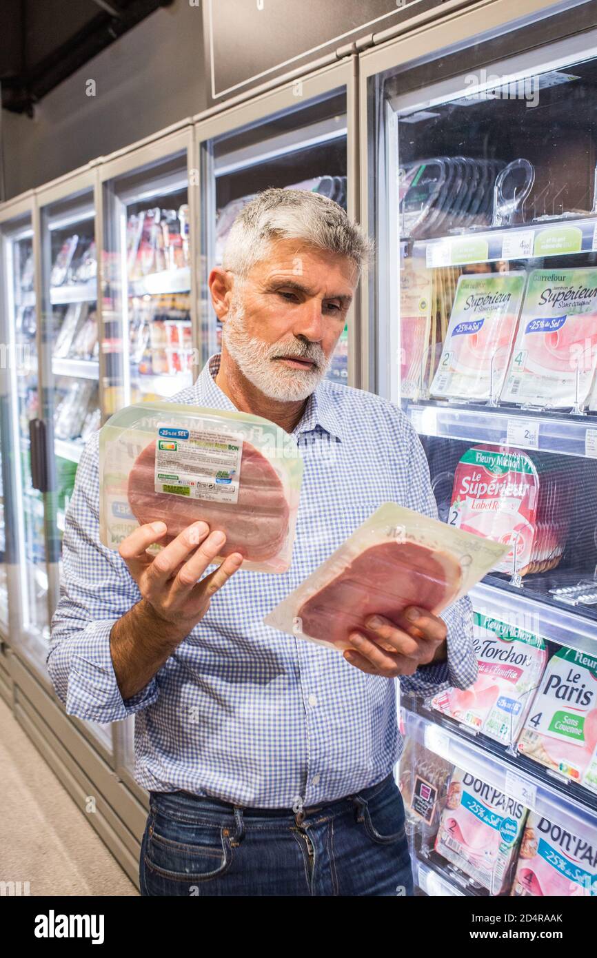 Man in a supermarket Stock Photo - Alamy