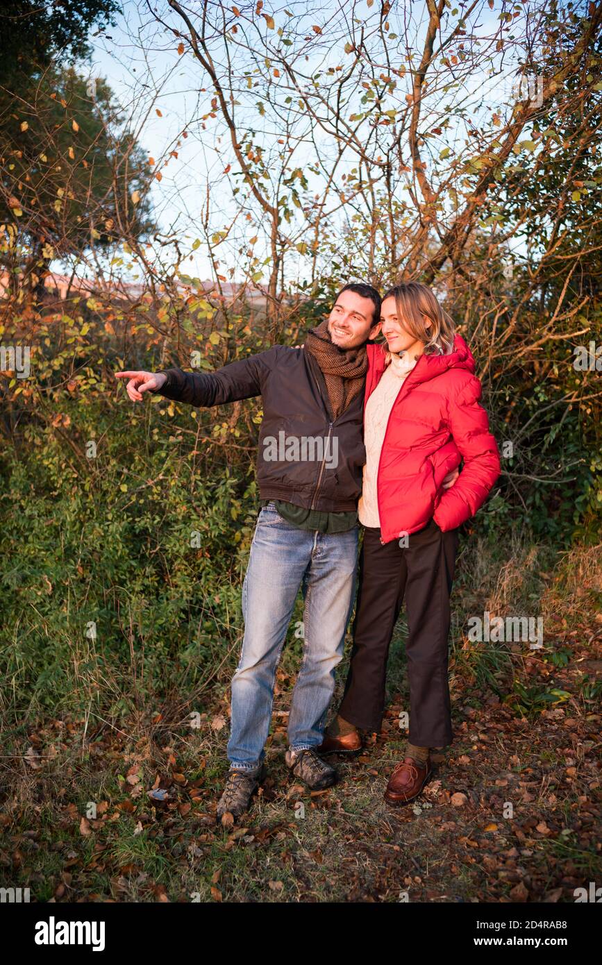 Couple visiting a land in the countryside Stock Photo - Alamy