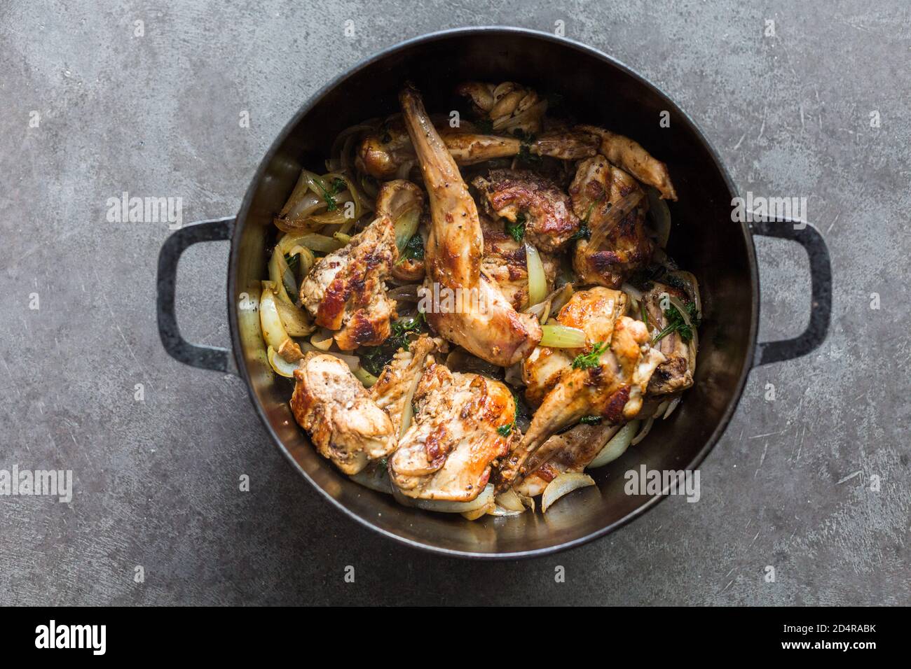 Roasted rabbit cooked in a cast iron casserole Stock Photo - Alamy