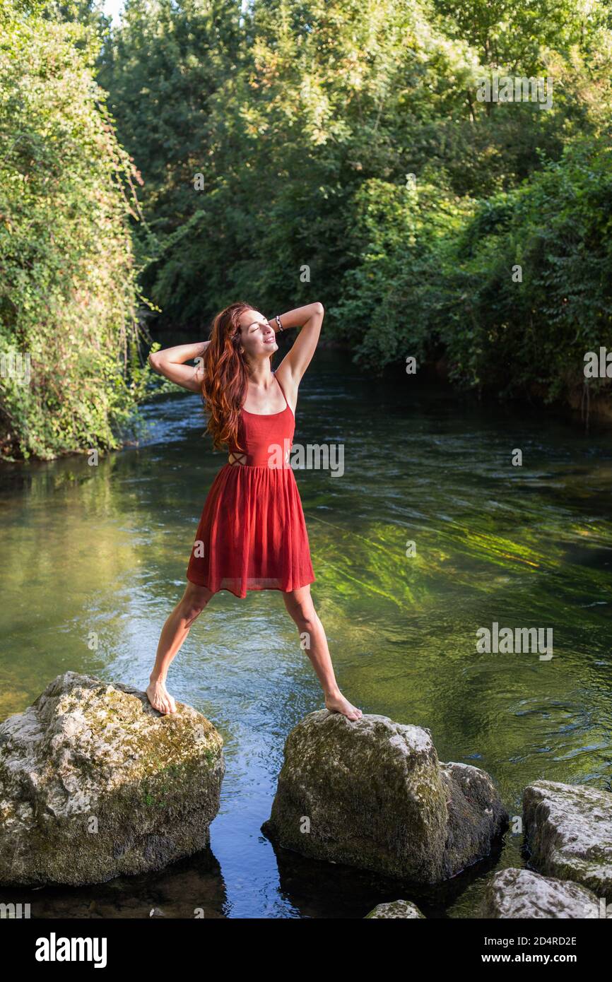 Woman walking on rocks hi-res stock photography and images - Alamy