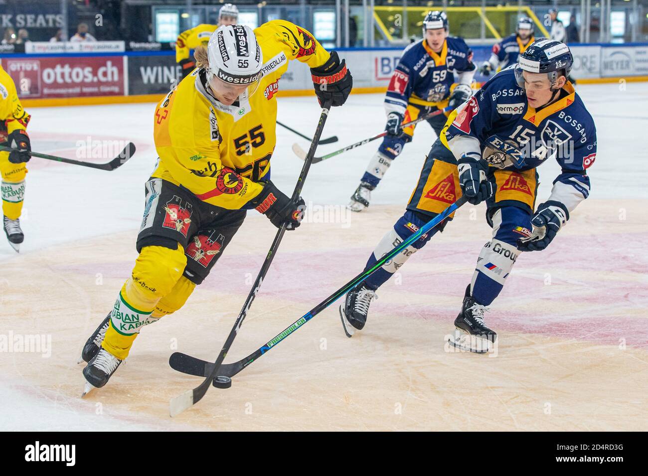# 55 Calle Andersson (Bern) and Gregory Hofmann # 15 (EV Zug) during ...