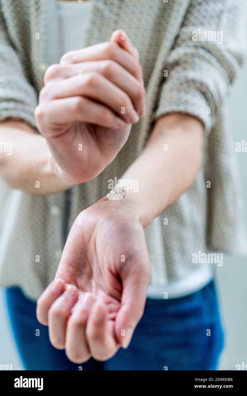 Woman applying estrogen gel on hi-res stock photography and images - Alamy