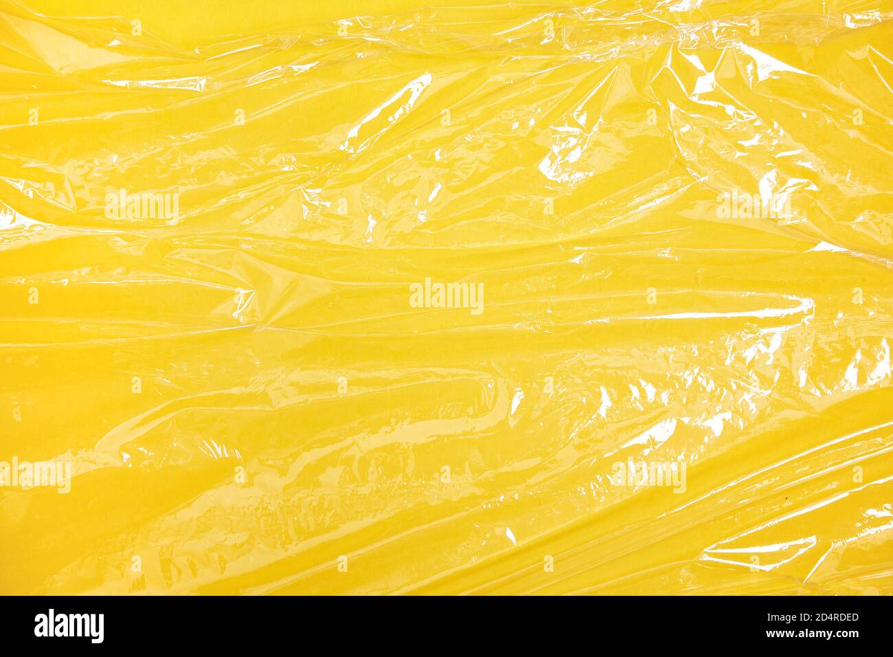 Clear plastic texture with yellow color. Nylon polythene wrap. Plastic ...
