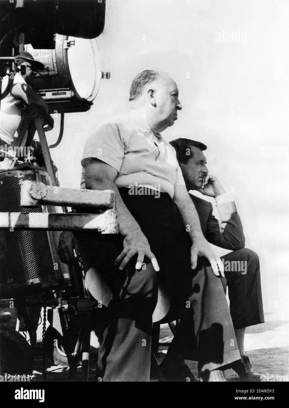 ALFRED HITCHCOCK and CARY GRANT on set location candid with Movie Crew ...