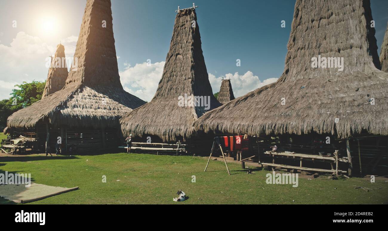 Sun over traditional house village on greenery valley aerial view ...