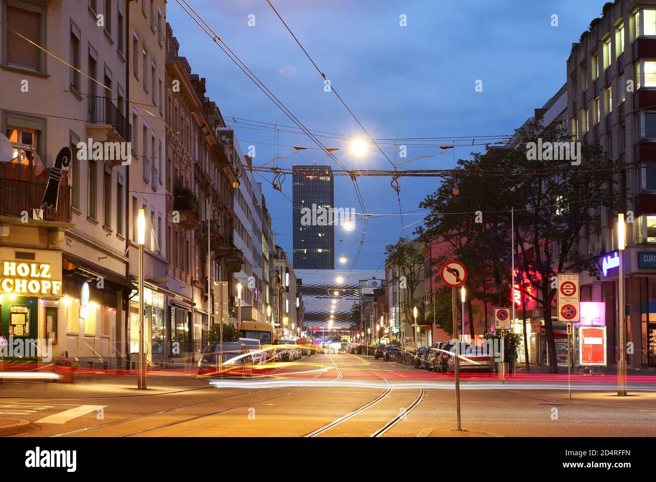Street scene in downtown Basel, Switzerland with Basler Messeturm ...