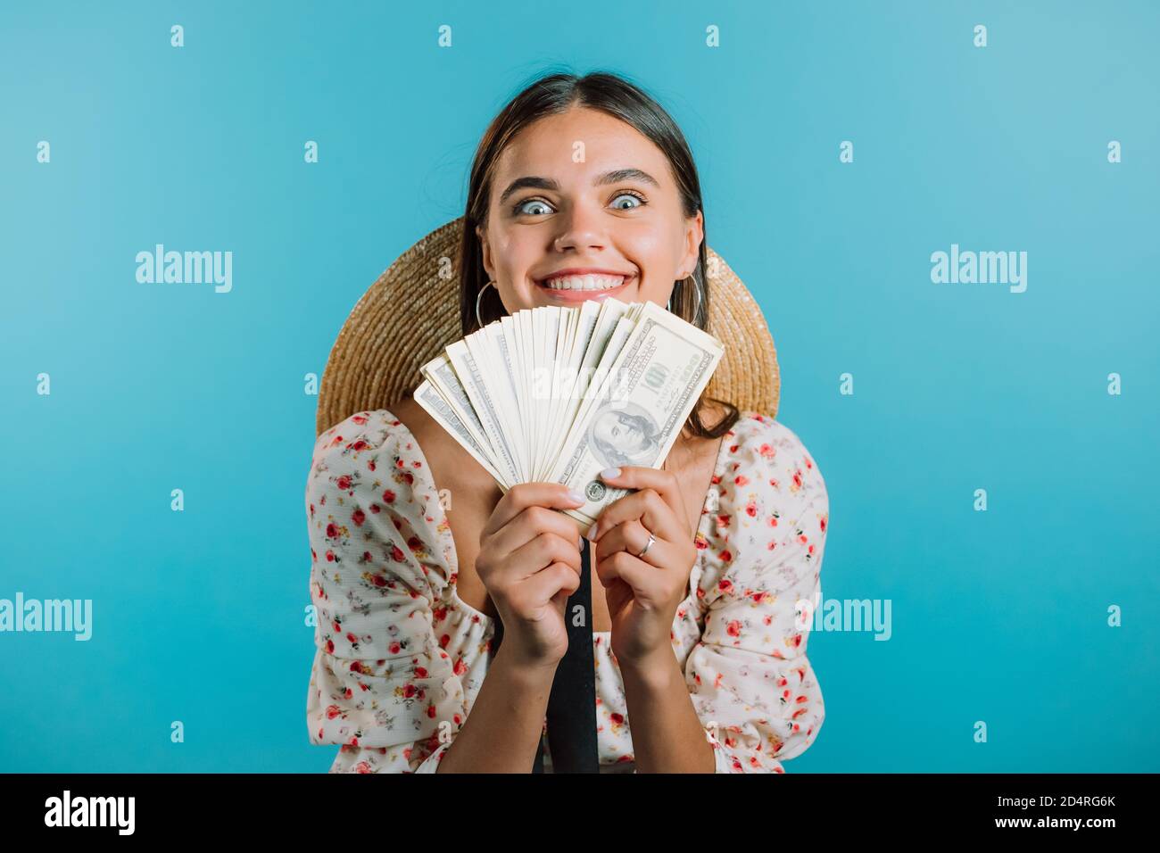 Amazed happy excited woman with money - U.S. currency dollars banknotes ...