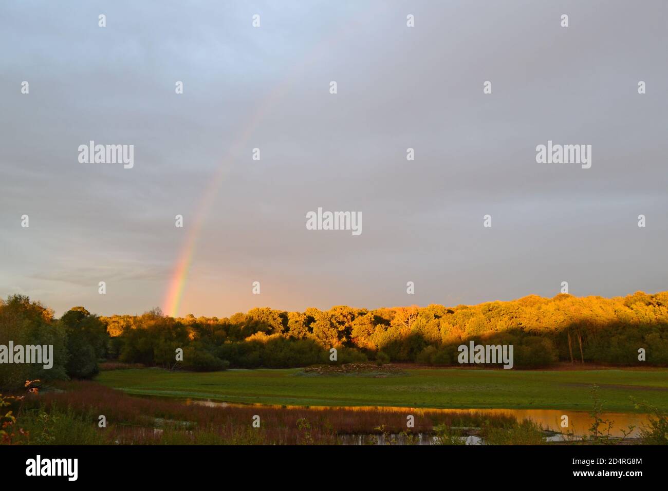 Rainbow at Bough Beech reservoir. View across the secondary lake of the ...