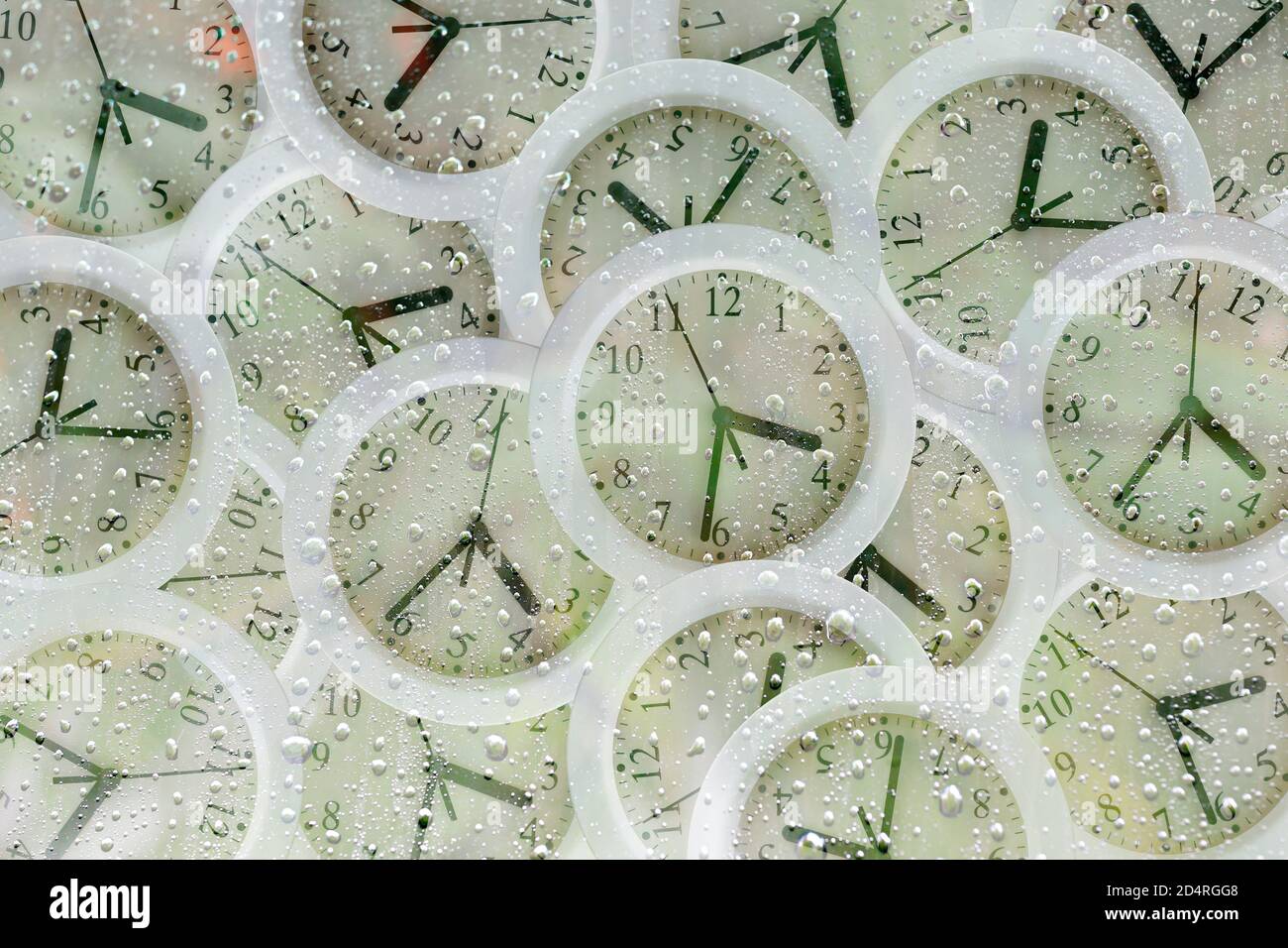 Background made with many clocks covered in water drops Stock Photo - Alamy