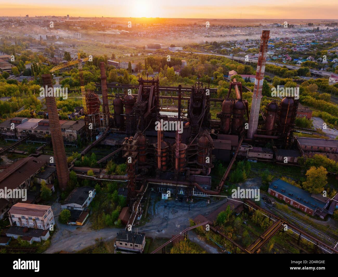 Blast furnace equipment of the metallurgical plant at the sunset ...