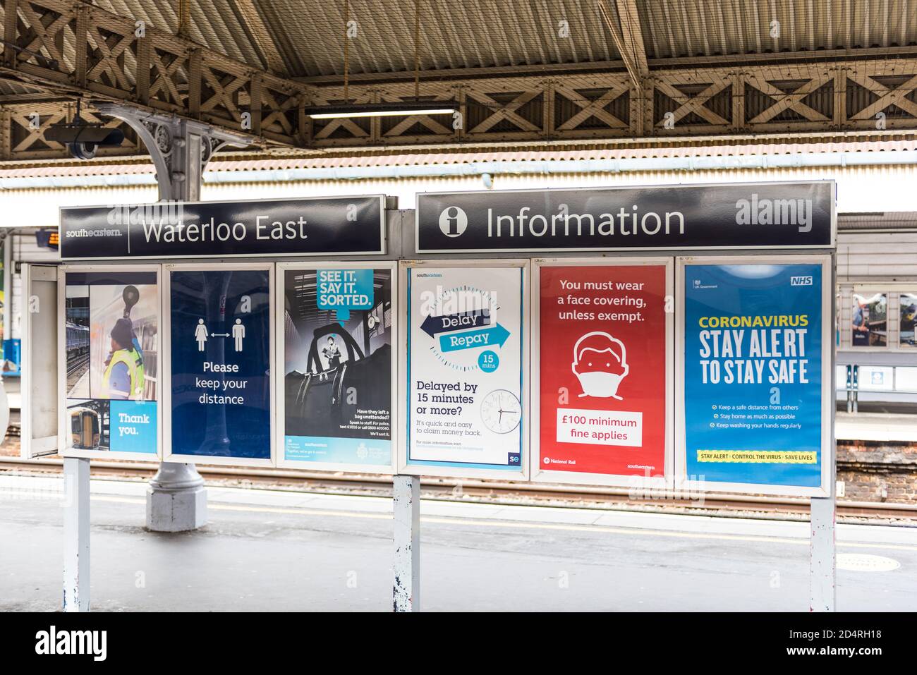 Coronavirus wear a face mask poster on platform Stock Photo - Alamy