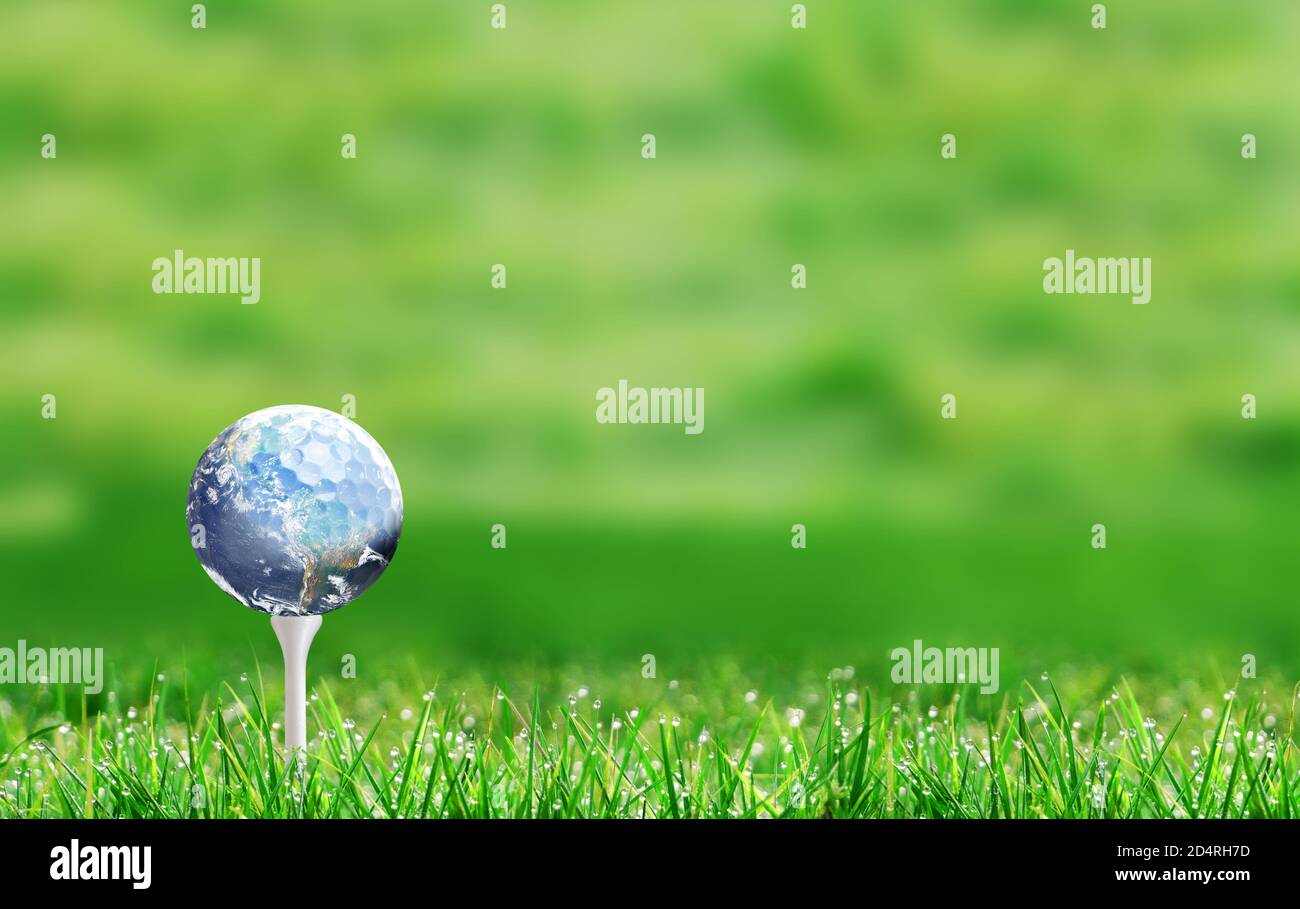 Planet earth golf ball on tee and with defocused bokeh golf course ...