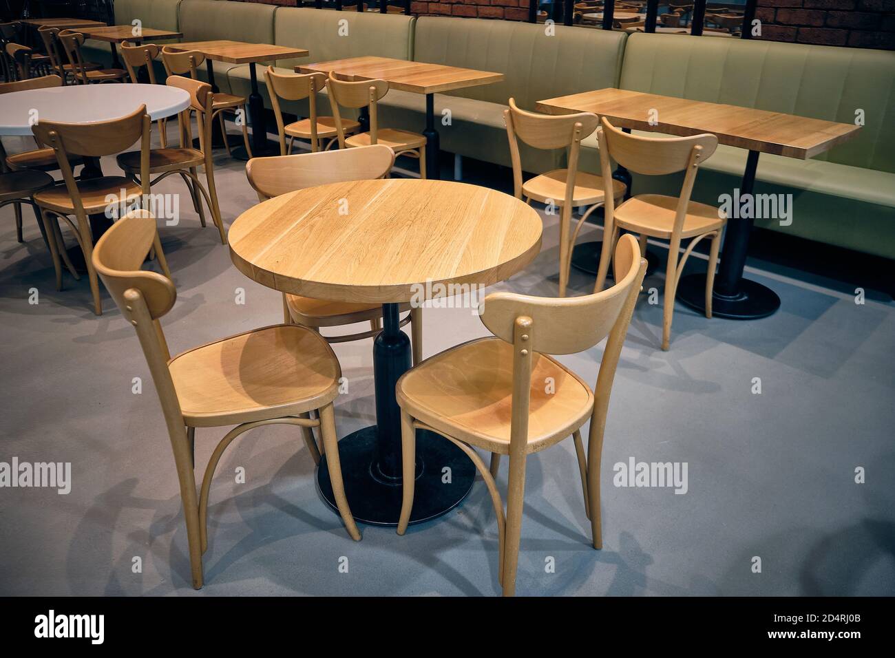 Wooden stools and wooden tables at cafe Stock Photo - Alamy