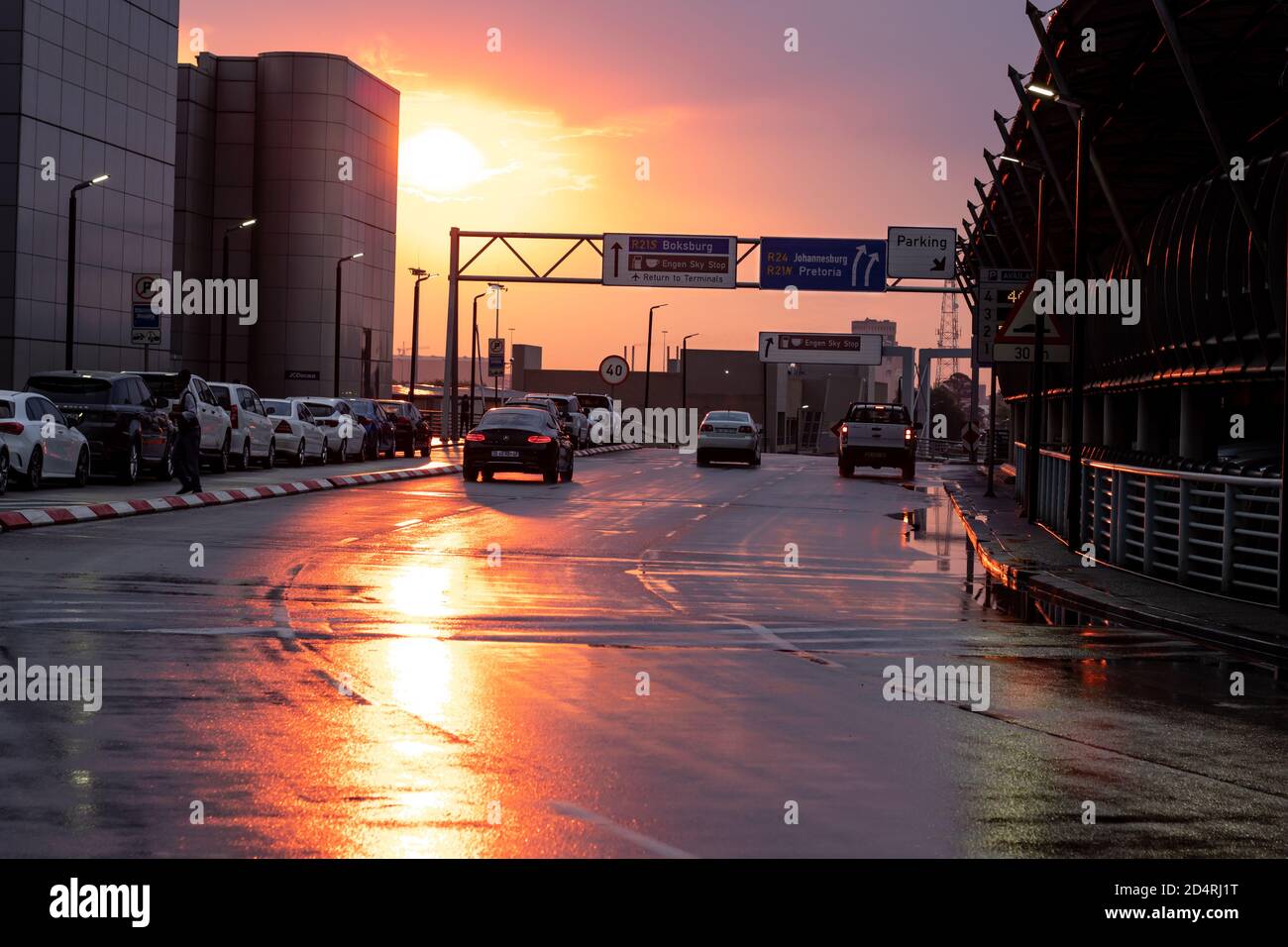 Sunset after the rain at OR Tambo airport exit Stock Photo - Alamy