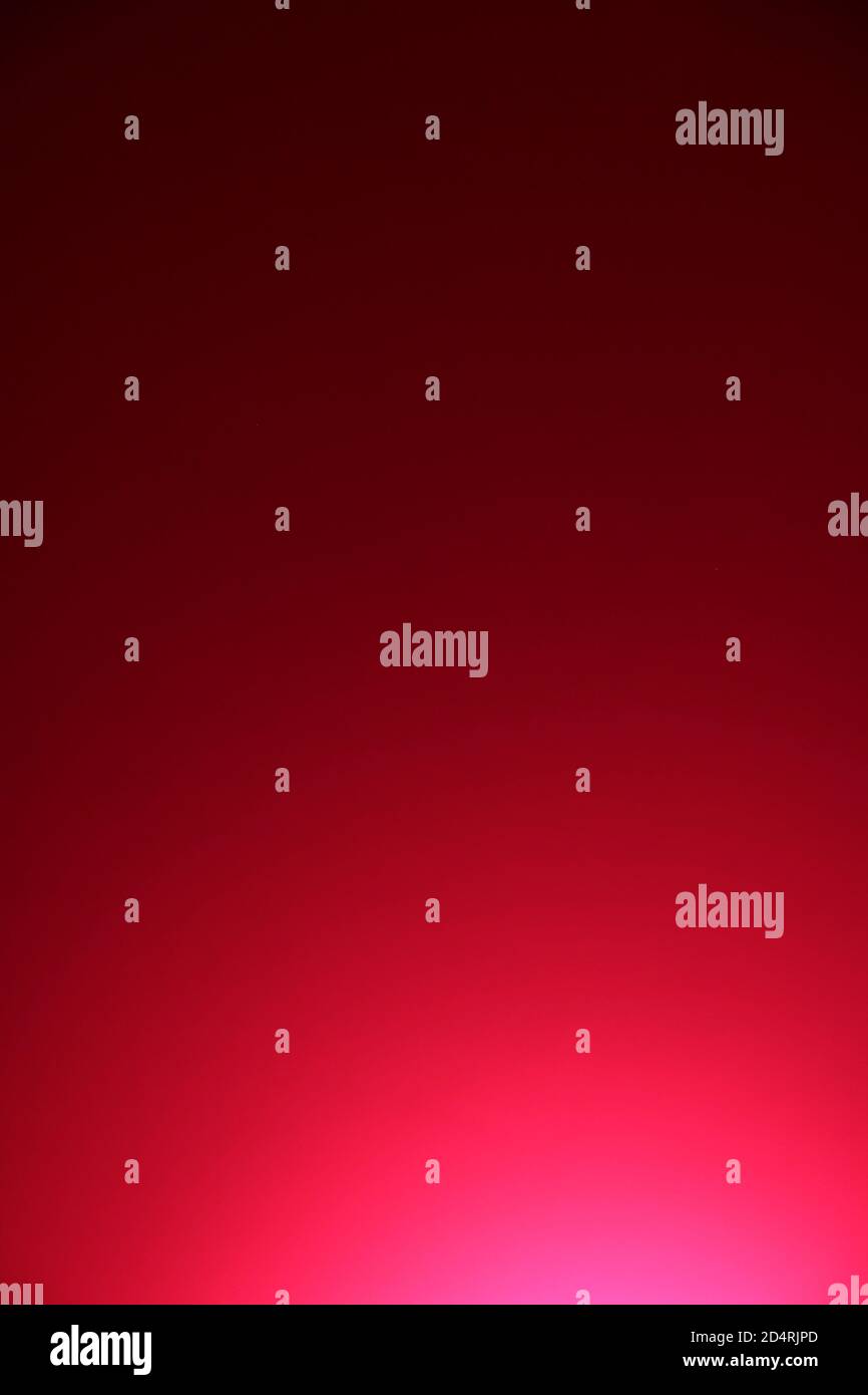 Studio photograph of radiating warm red light reflected on wall Stock ...