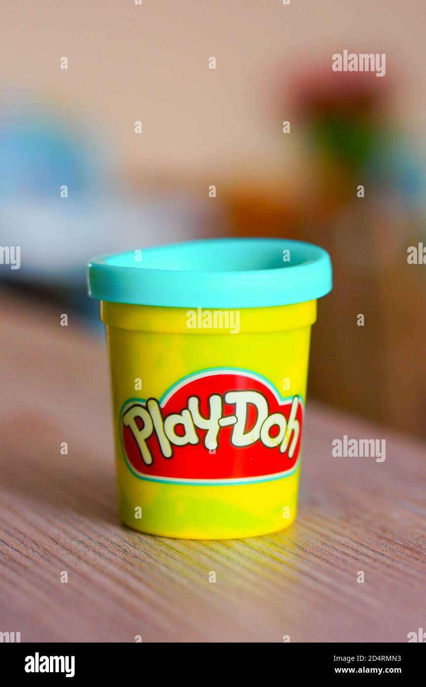 POZNAN, POLAND - Mar 16, 2018: Light blue Play-Doh clay in a yellow ... POZNAN, POLAND - Mar 16, 2018: Light blue Play-Doh clay in a yellow ...