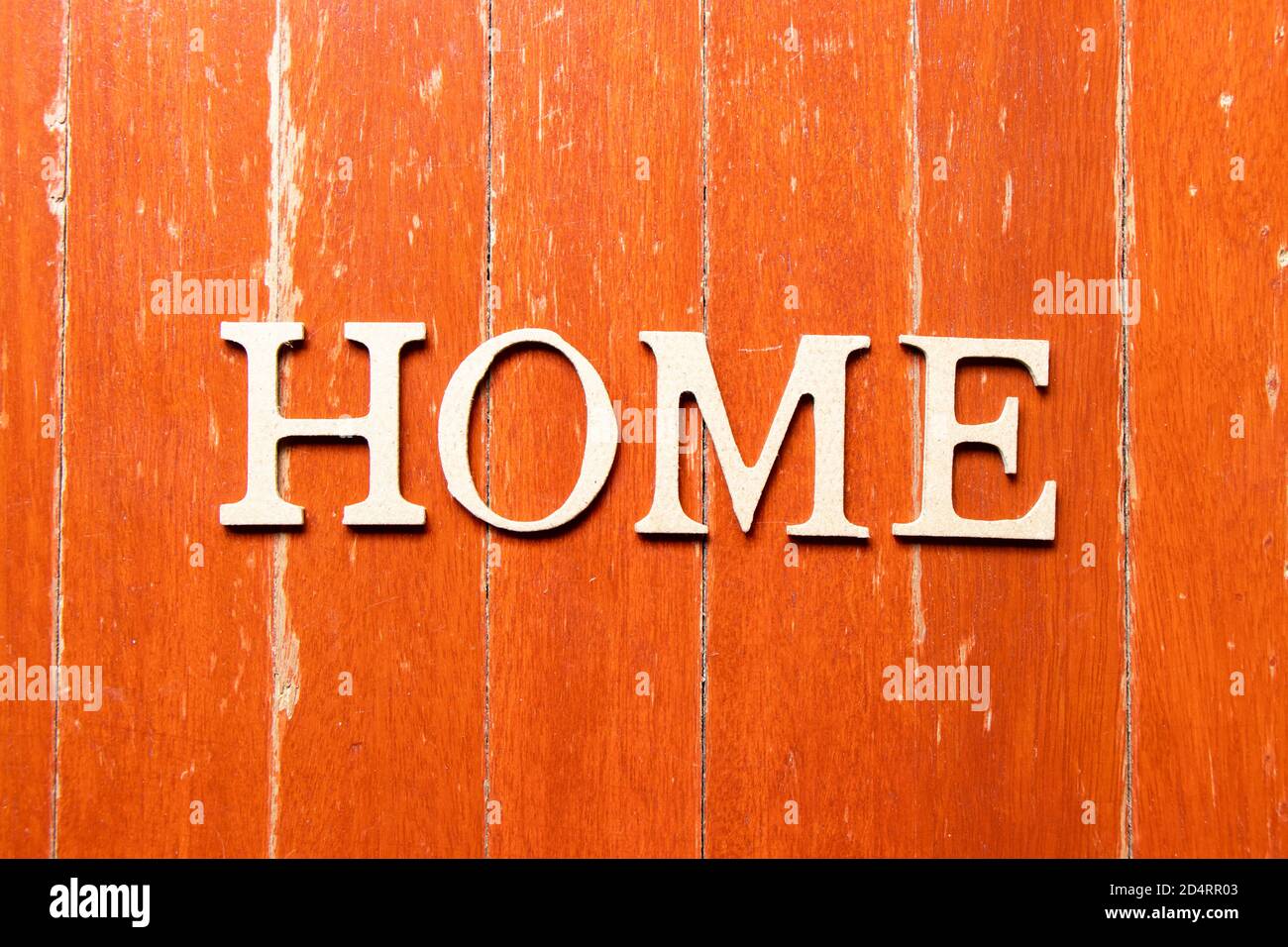 Alphabet letter in word home on old red color wood plate background ...
