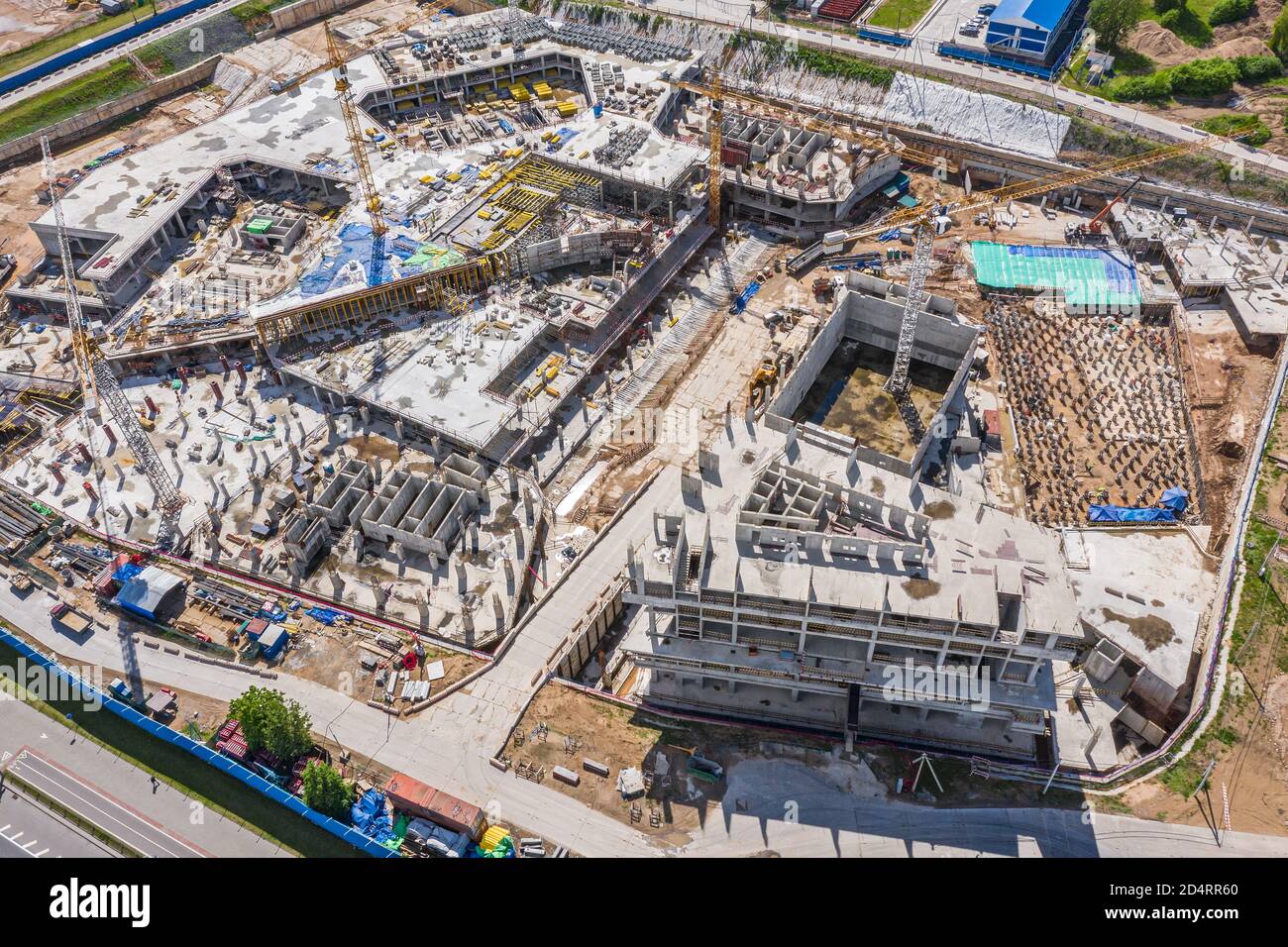 large construction site with working construction cranes. top view of ...