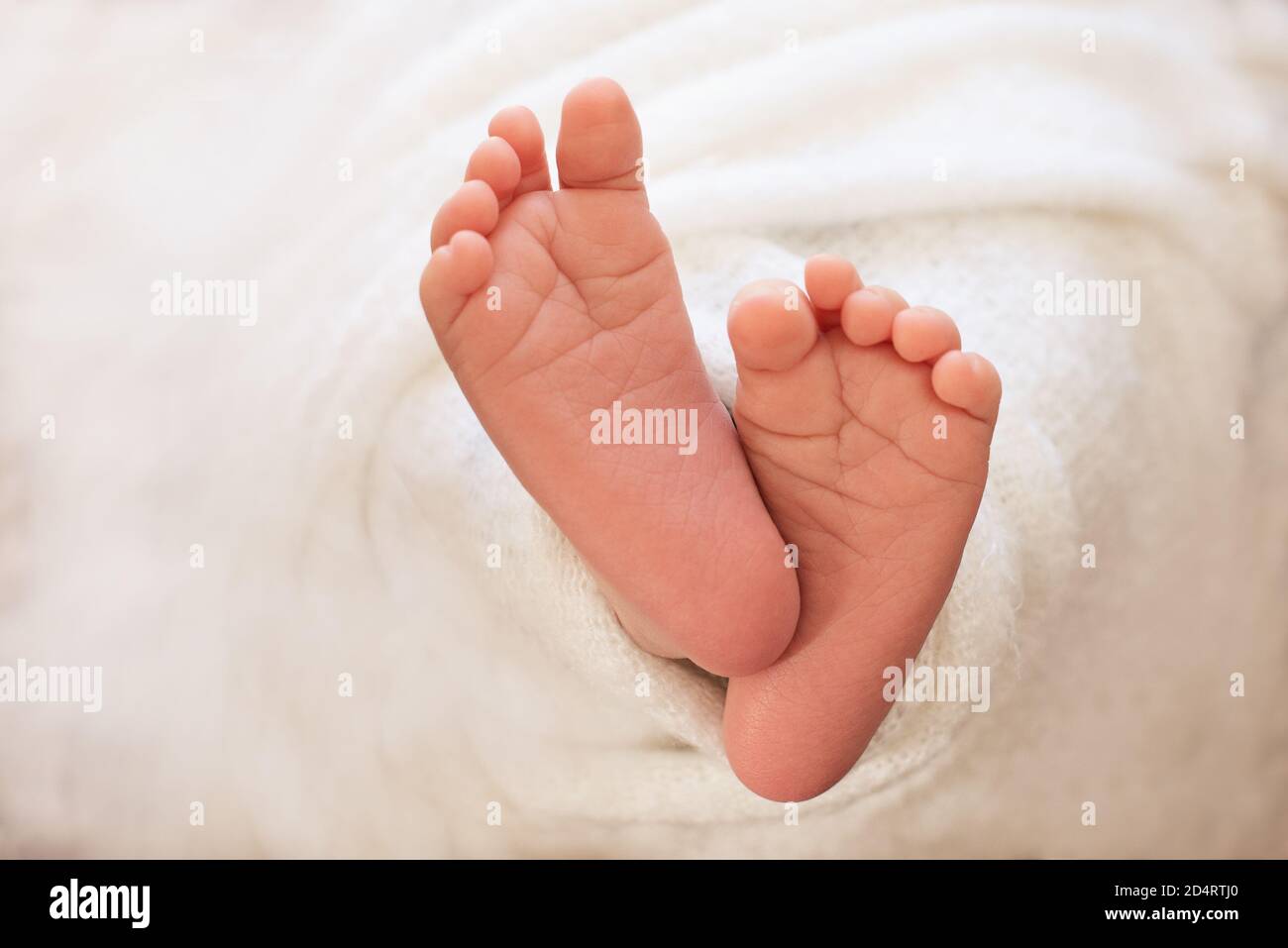 Foot of the newborn baby, tenderness. copy space in winter concept ...