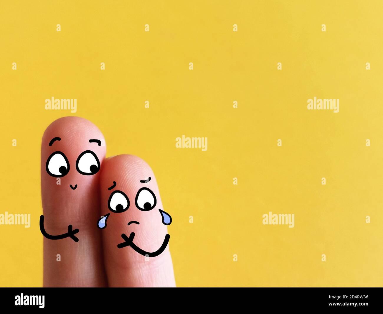 Two fingers are decorated as two person. One of them is crying ...