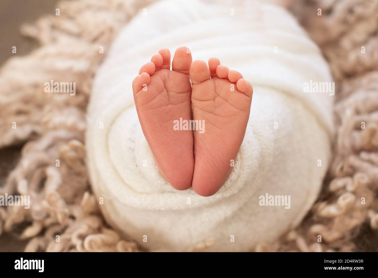 Foot of the newborn baby, tenderness. copy space in winter concept ...