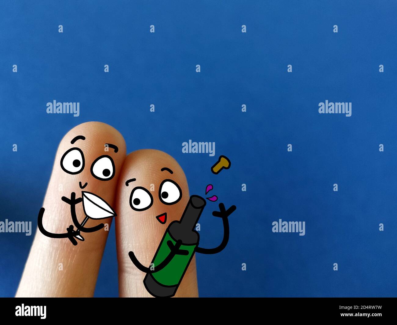 Two fingers are decorated as two person. They are drinking wine Stock ...