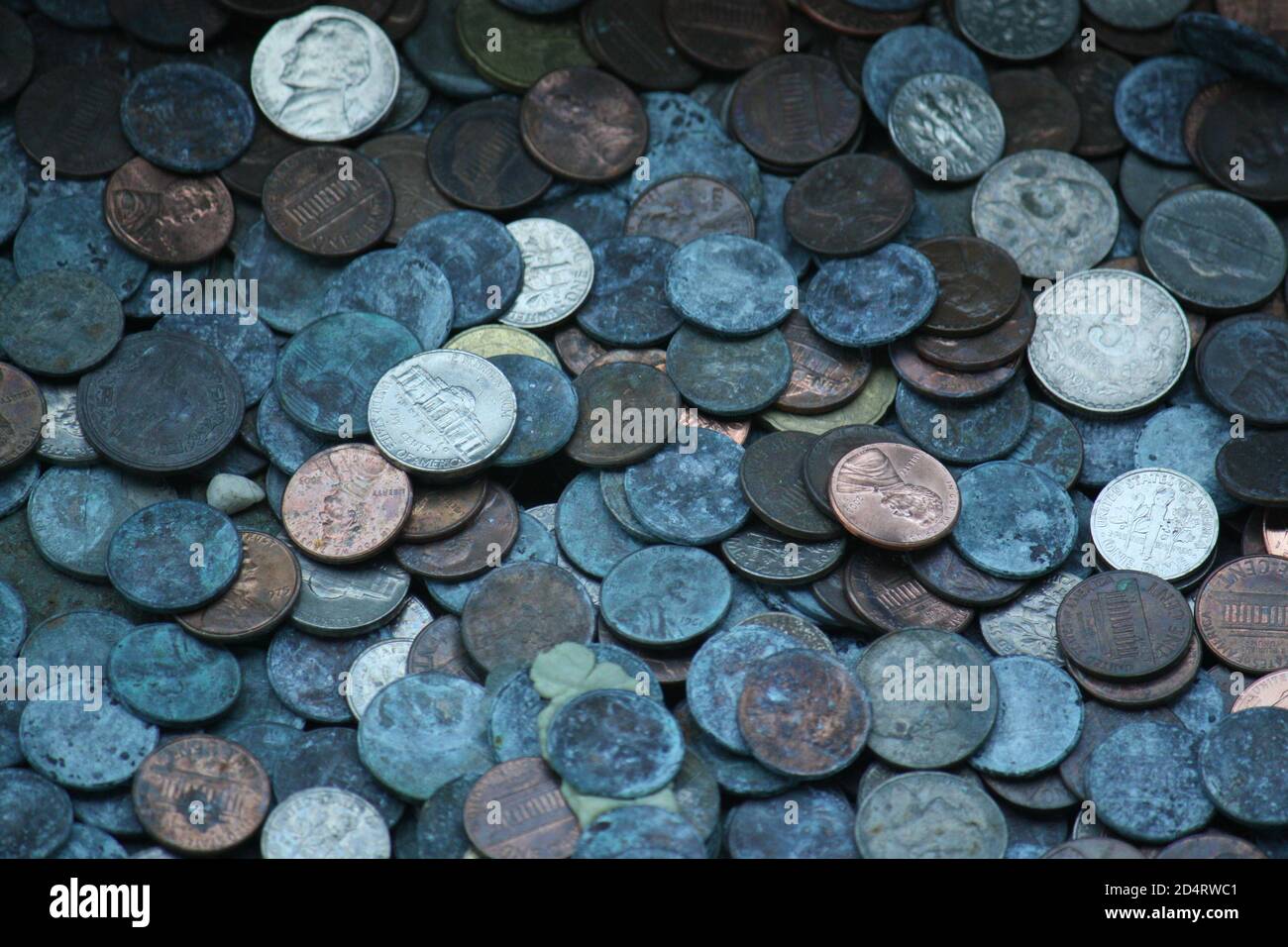 Coins in gutter of the dock with the statute of liberty, New York Stock ...