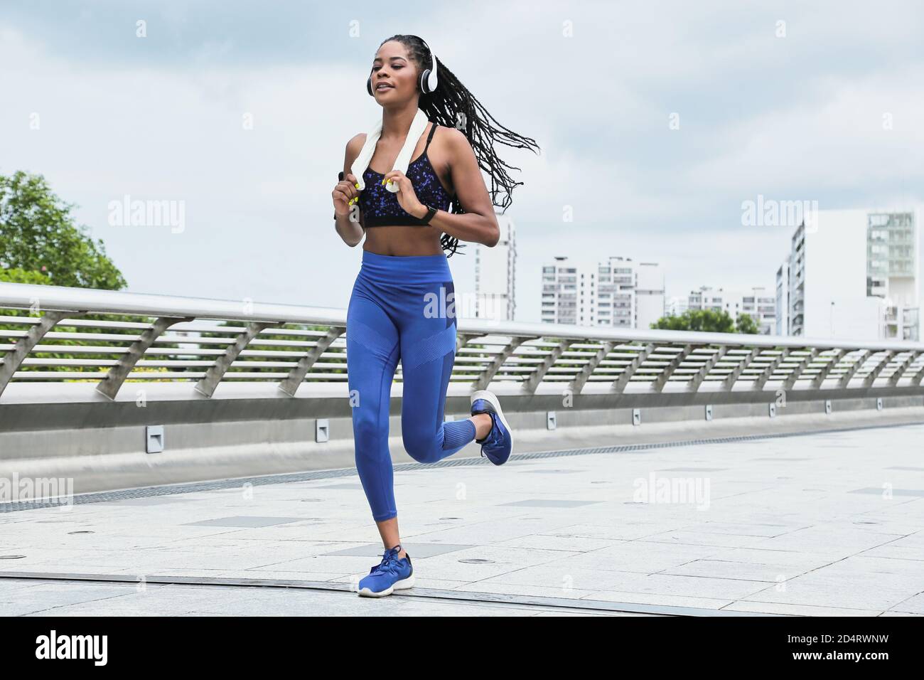 Fit woman jogging Stock Photo - Alamy
