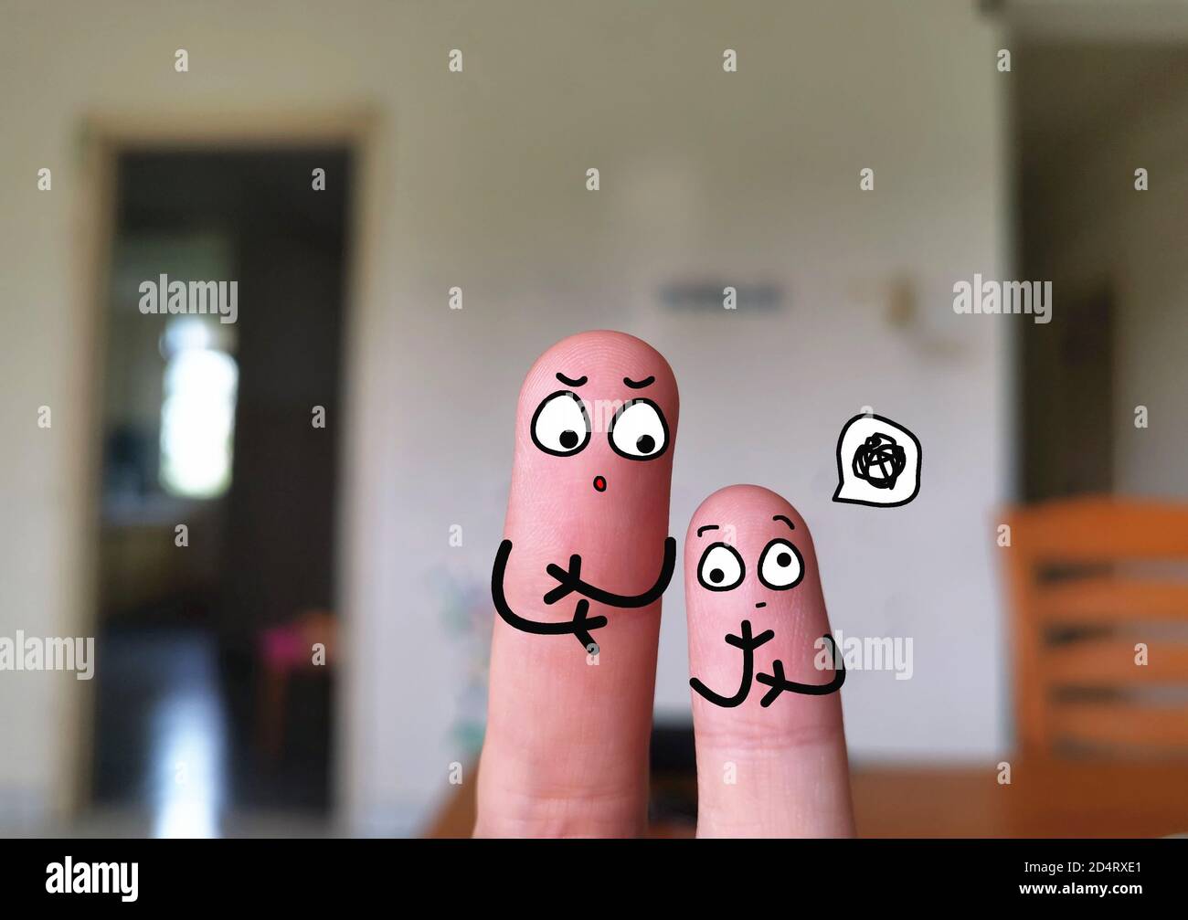 Two fingers are decorated as two person. One of them is a teenager. He ...