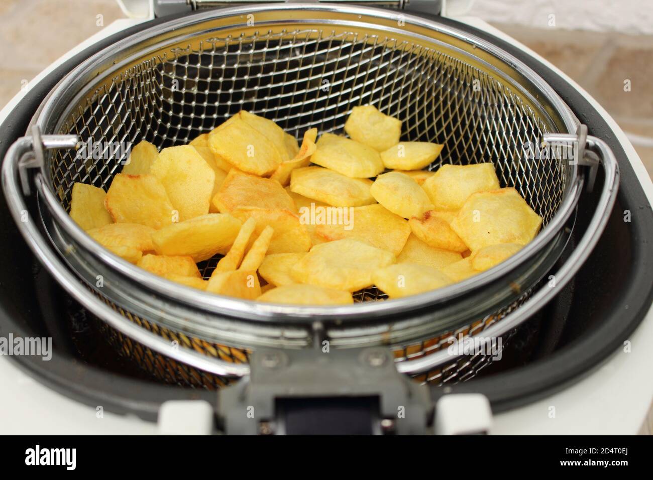 fresh crispy french fries from the deep fryer Stock Photo - Alamy