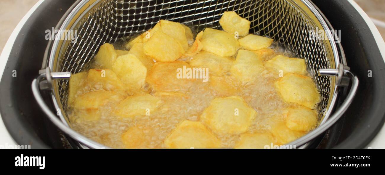 fresh crispy french fries from the deep fryer Stock Photo - Alamy