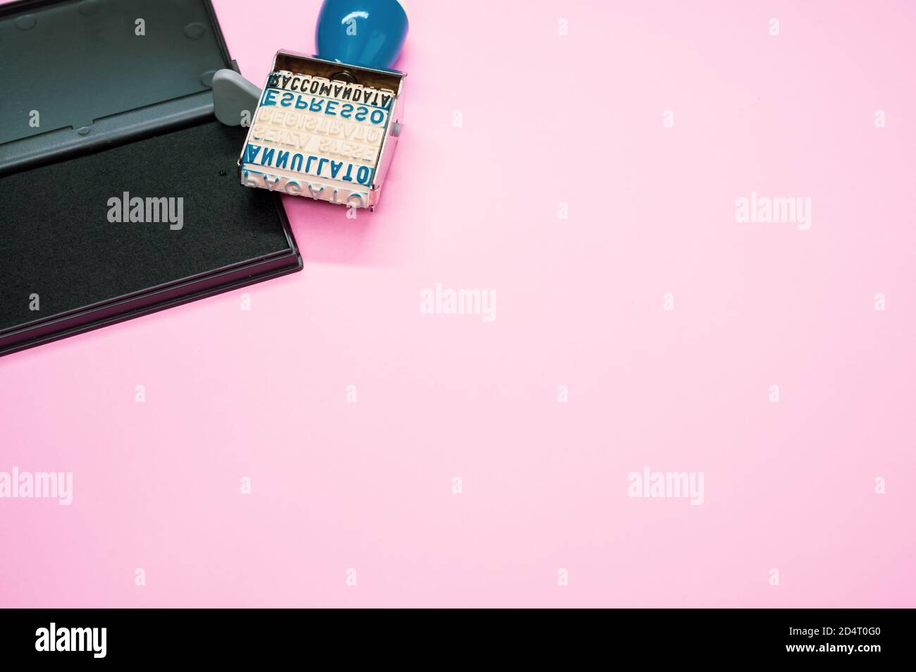 Top view of a rubber stamp roller with words on it with ink isolated on ...