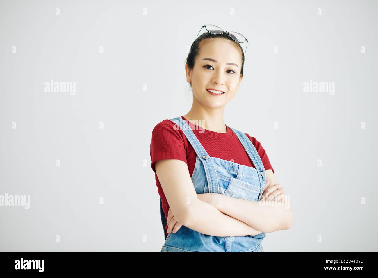 Pretty young woman in overall Stock Photo - Alamy