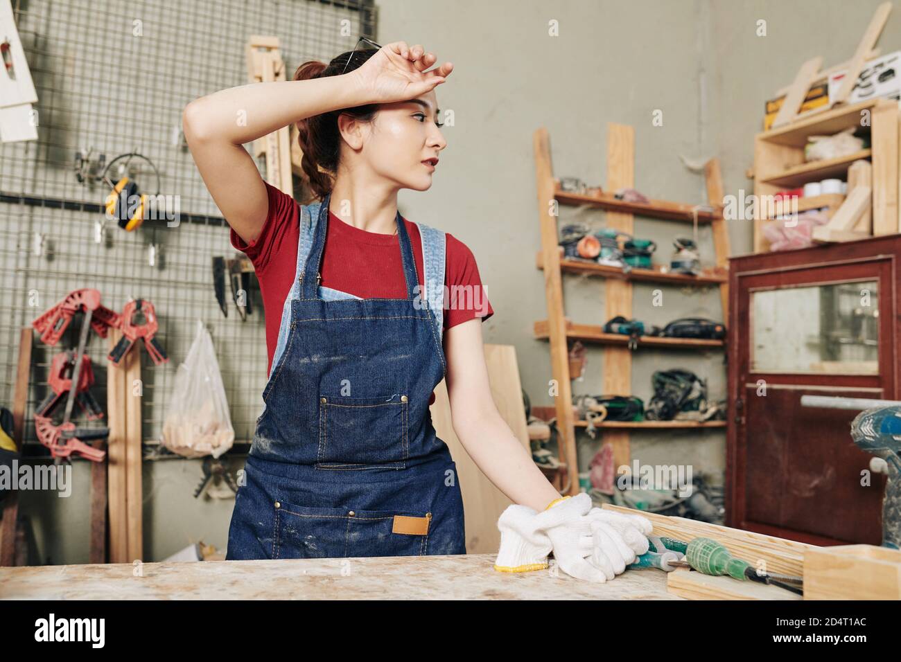 Worker wiping sweat hi-res stock photography and images - Alamy