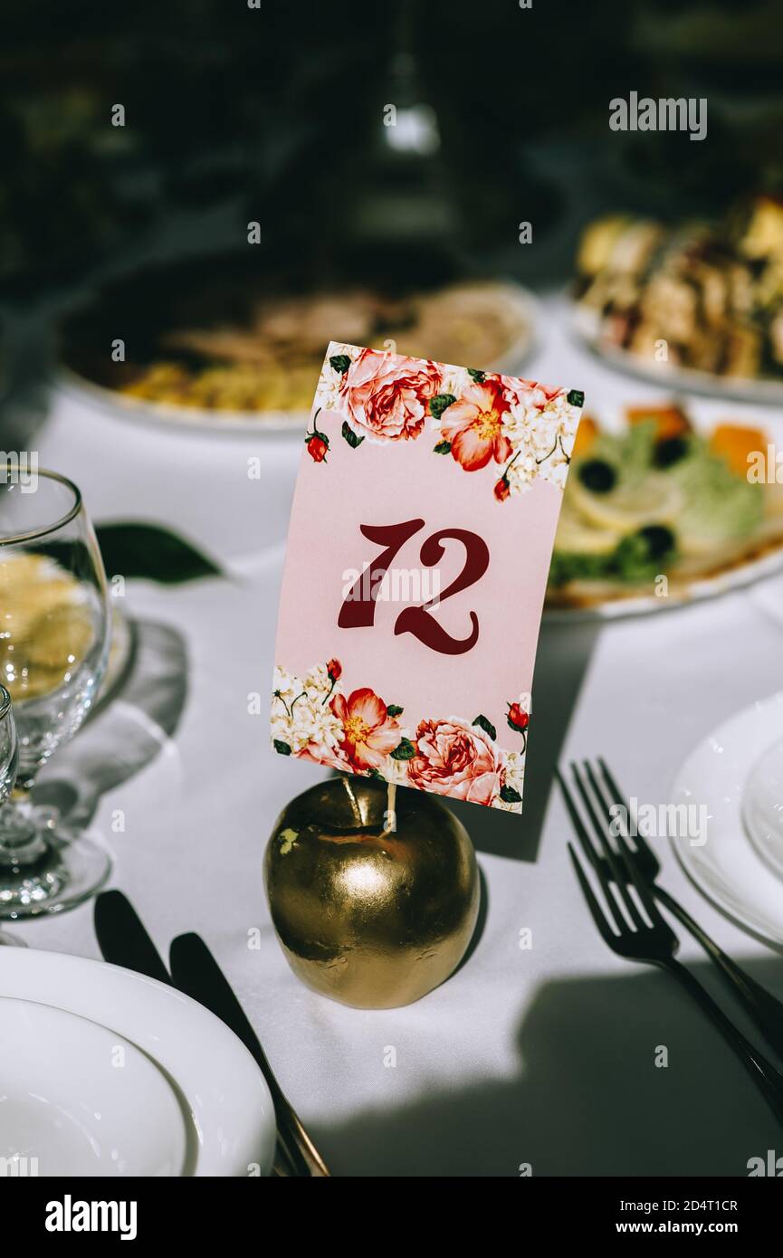 Table number twelve. Interior of restaurant for wedding dinner, ready ...