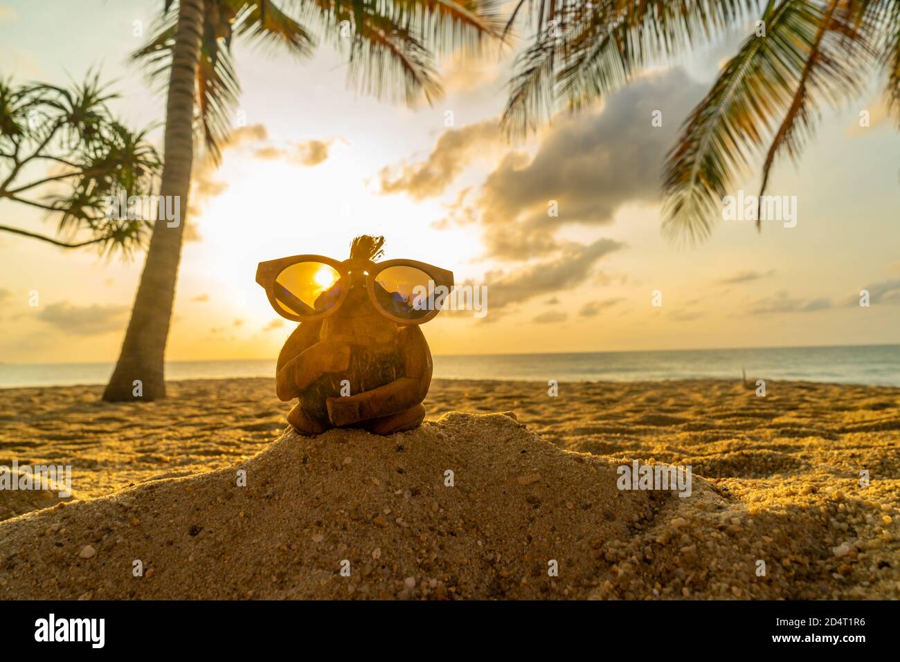 Monkey coconut sculpture at the beach in Thailand Stock Photo - Alamy
