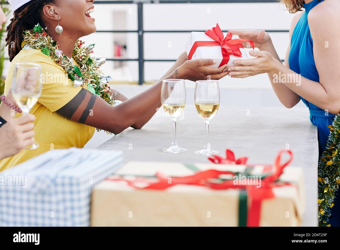 Gift exchanging hands hi-res stock photography and images - Alamy