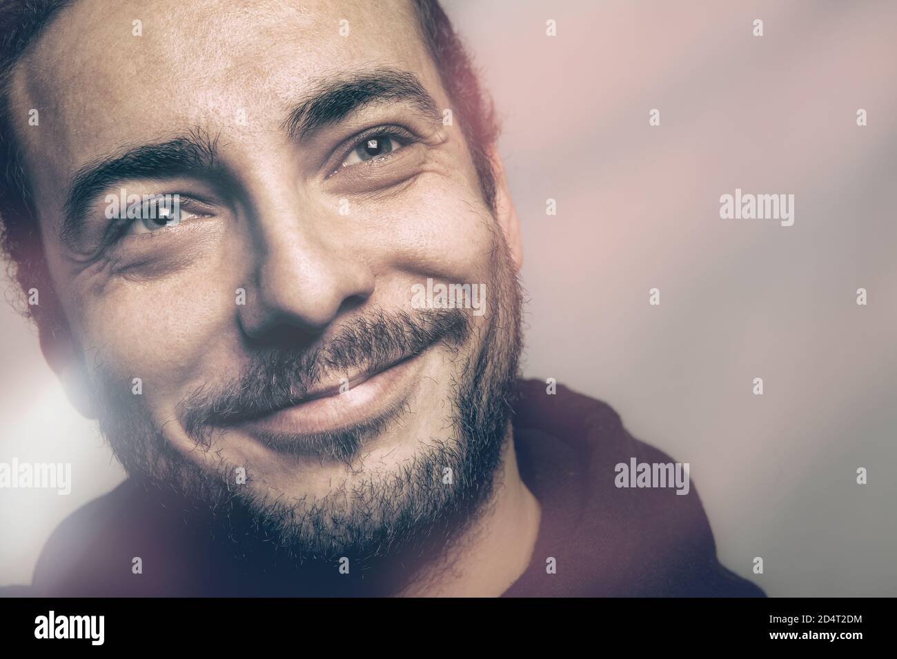 Joyful beautiful man, joy and hope. A young man with beard smiling ...