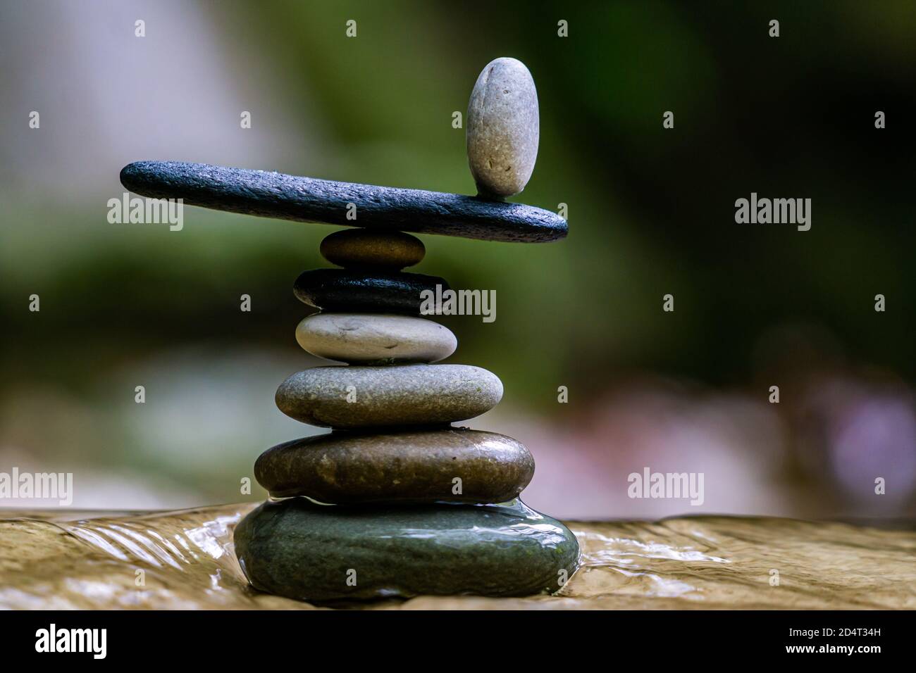 Balanced Zen stones pebbles at the waterfalls Stock Photo - Alamy