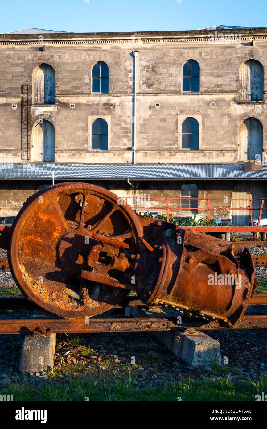 Parts of steam engines, and historic stone warehouse, Oamaru, Otago ...