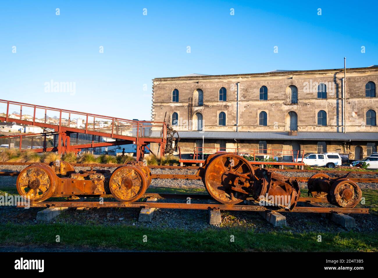 Parts of steam engines, and historic stone warehouse, Oamaru, Otago ...