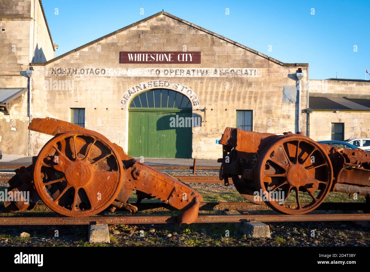Parts of steam engines, and historic stone warehouse, Oamaru, Otago ...